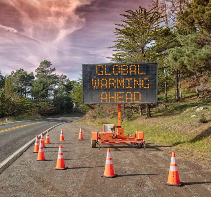 GLOBAL WARMING AHEAD: Roadside sign: Trailer mobile warning sign parked ...